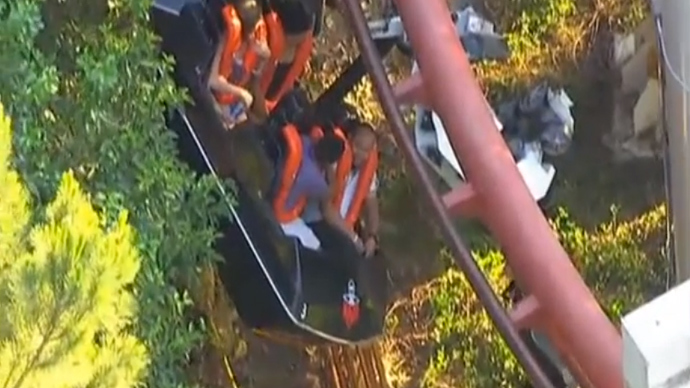 22 people trapped on 'Ninja Ride' roller coaster after tree falls on ...